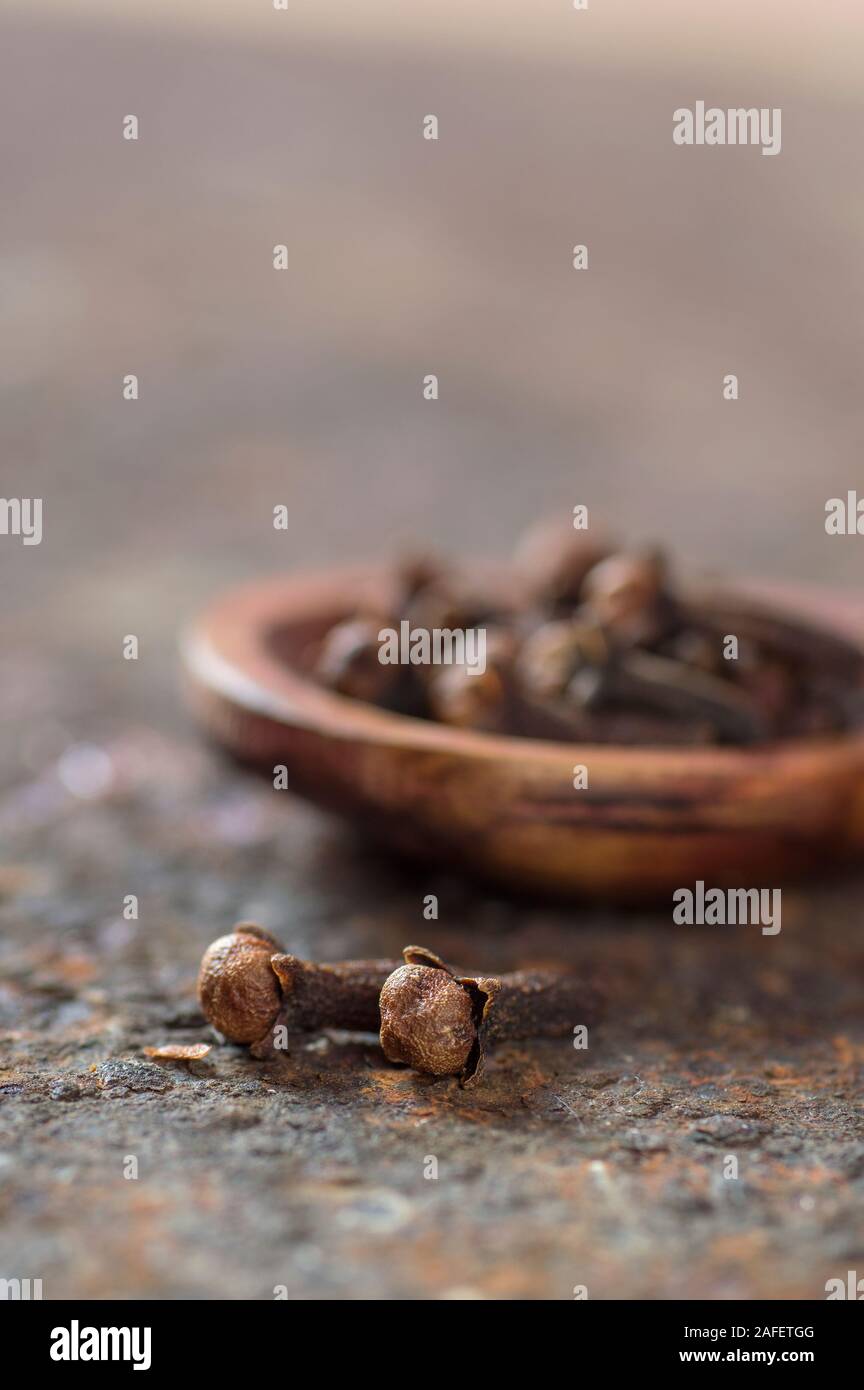 Cloves on a textured background. Spices, Food and cuisine ingredients ...