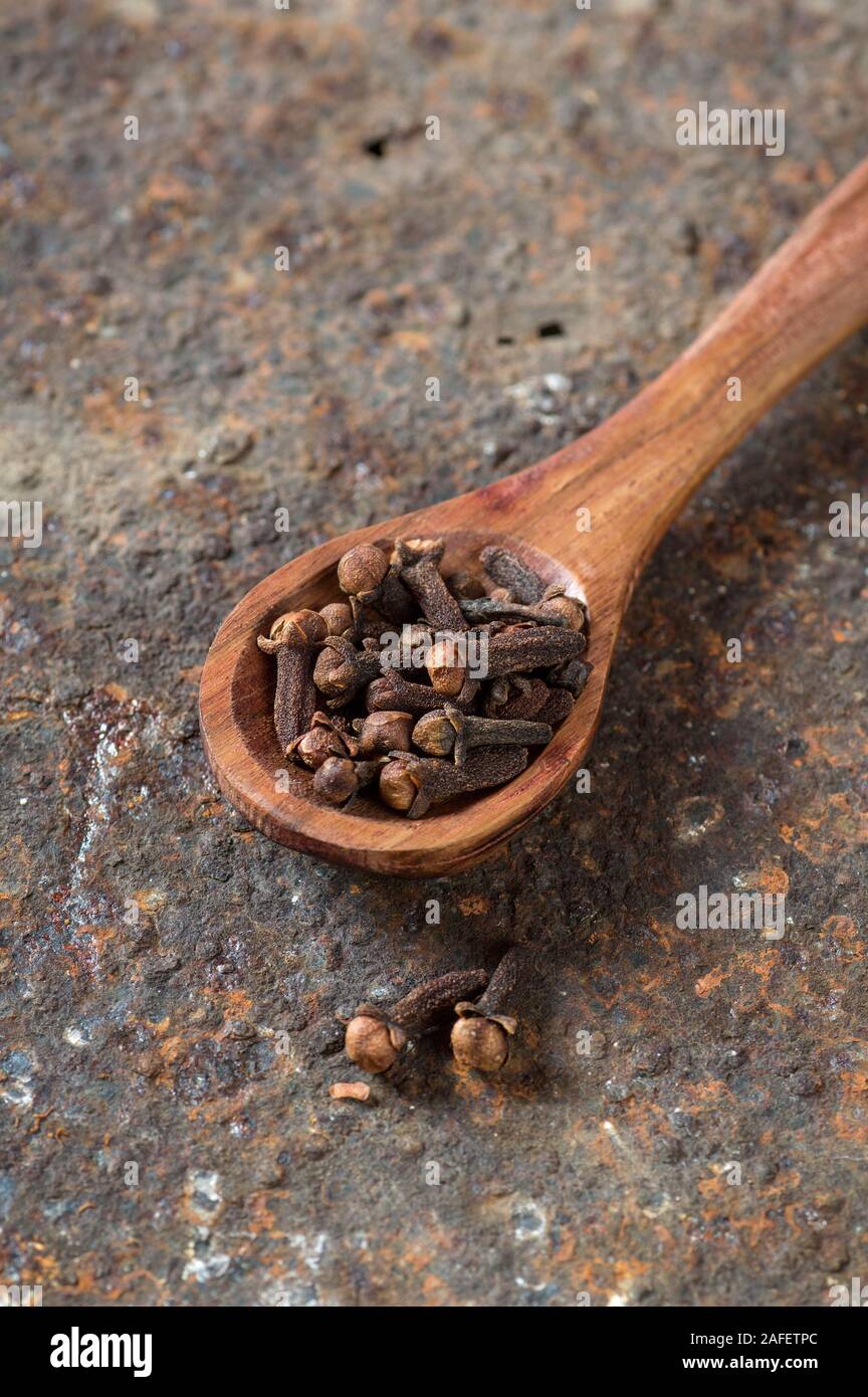 Cloves on a textured background. Spices, Food and cuisine ingredients ...