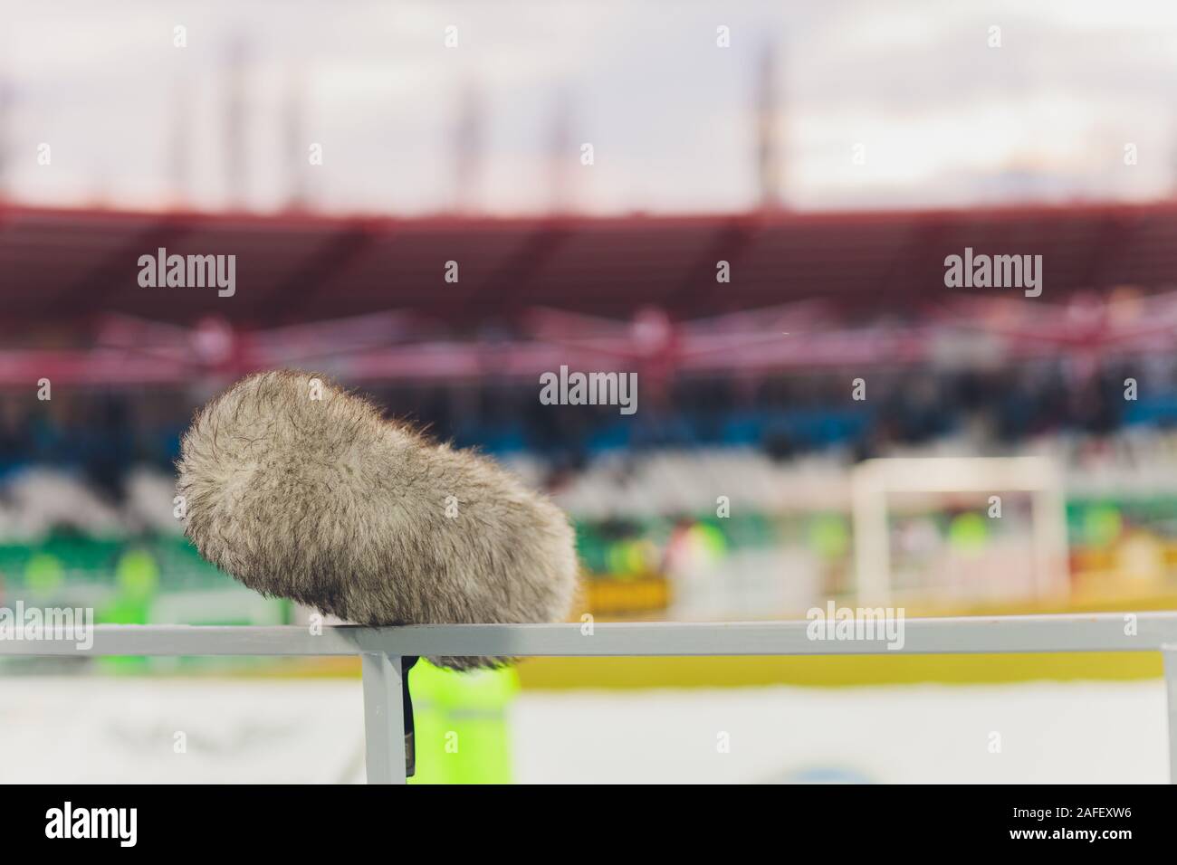 A large microphone boom with windshield for TV or Radio situated at the ...