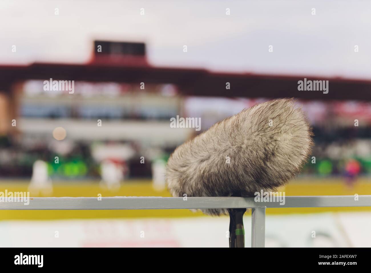 A large microphone boom with windshield for TV or Radio situated at the ...