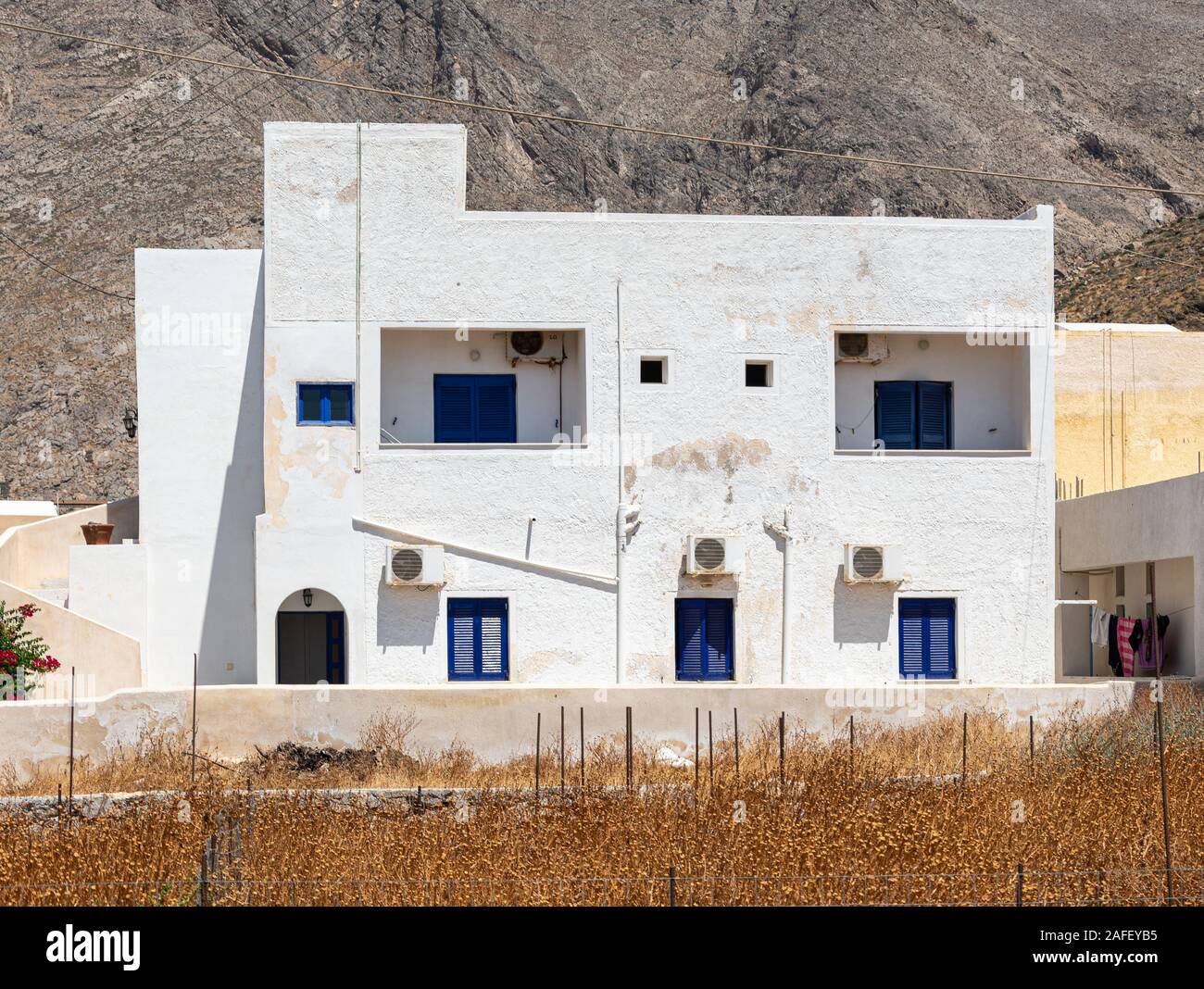 Perissa, Greece - July 18 2019: An old whitewashed house on the ...
