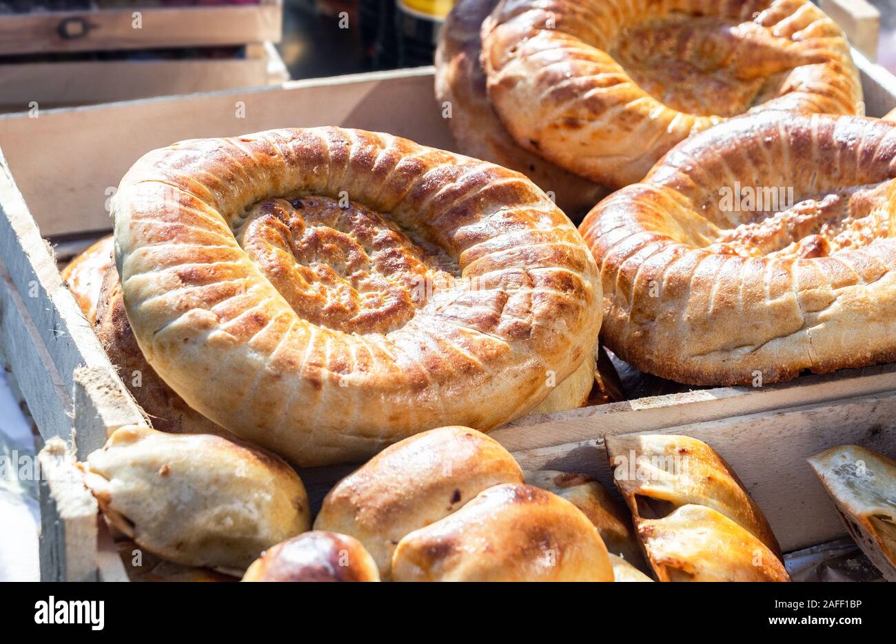Traditional appetizing uzbek flatbreads with sesame seeds from the ...