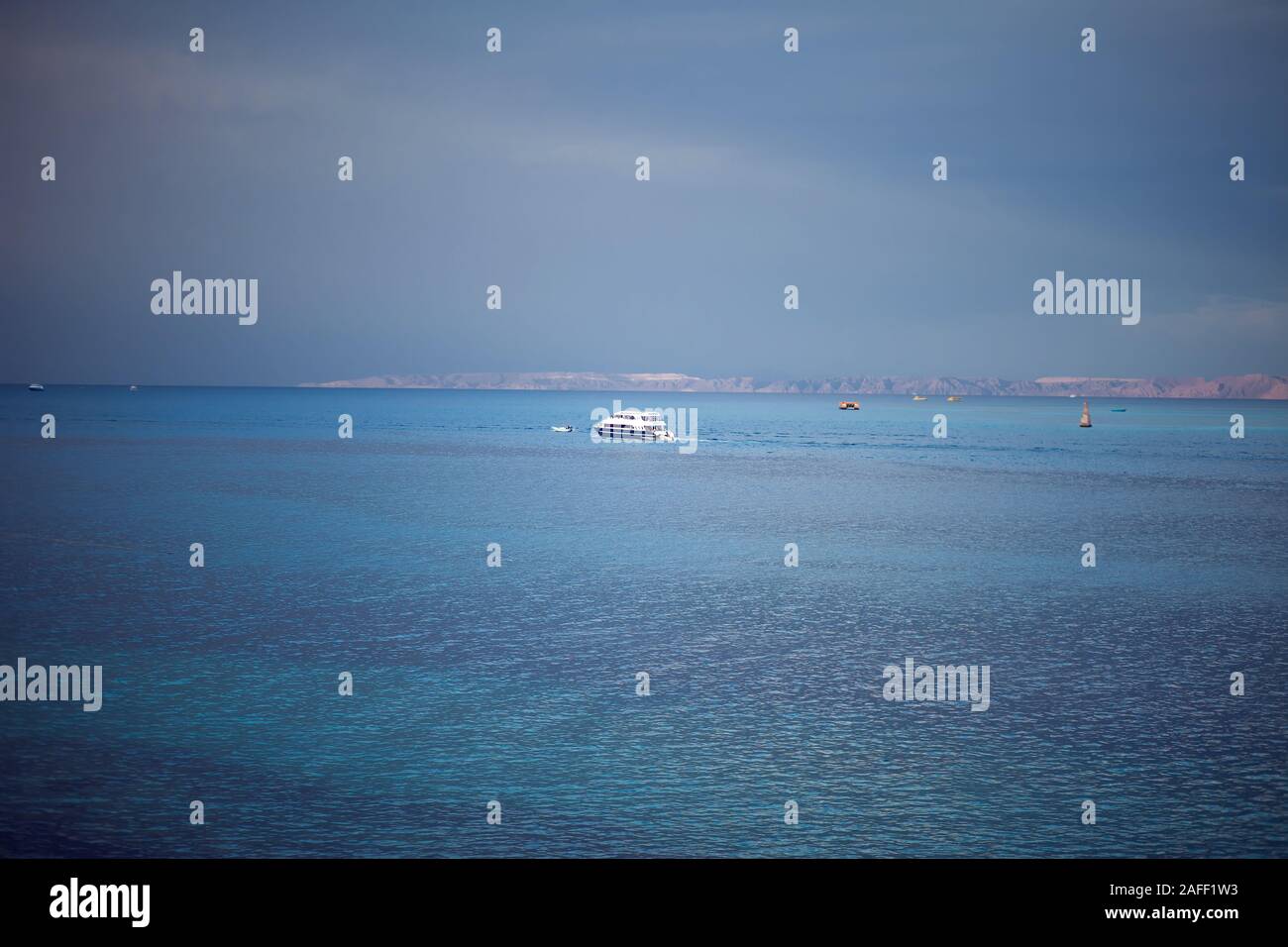 The view of Red sea with ship and cloudly sky before rain in Hurhgada ...