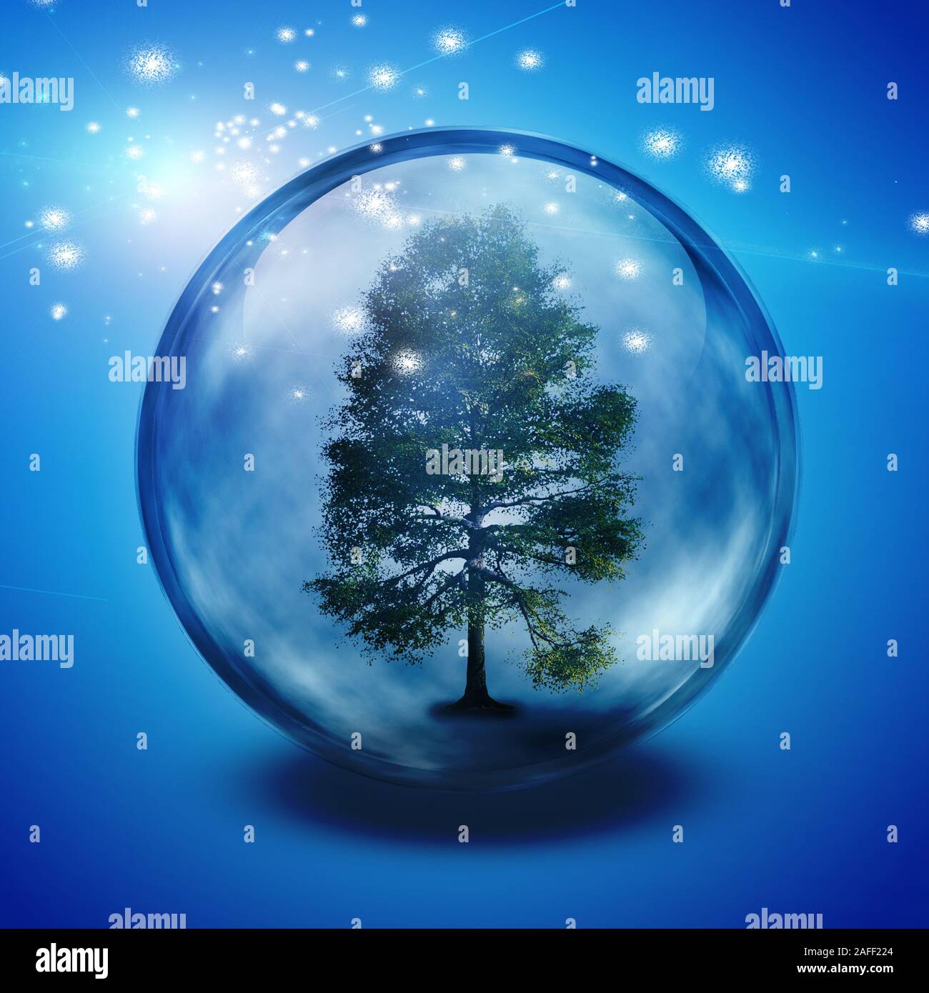 Green tree inside crystal ball Stock Photo - Alamy