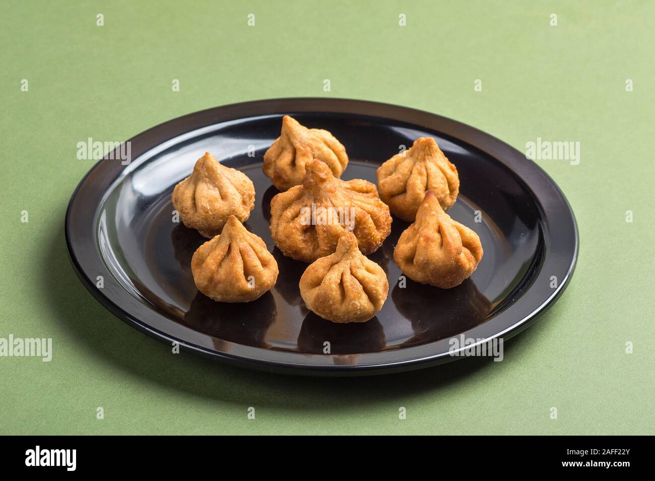 Indian Food: Modak on green background, Maharashtra Sweet Dish ...