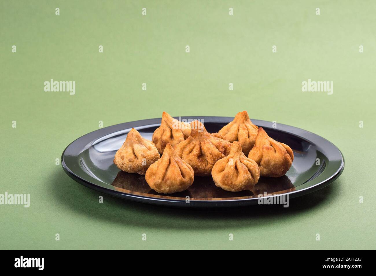 Indian Food: Modak on green background, Maharashtra Sweet Dish ...