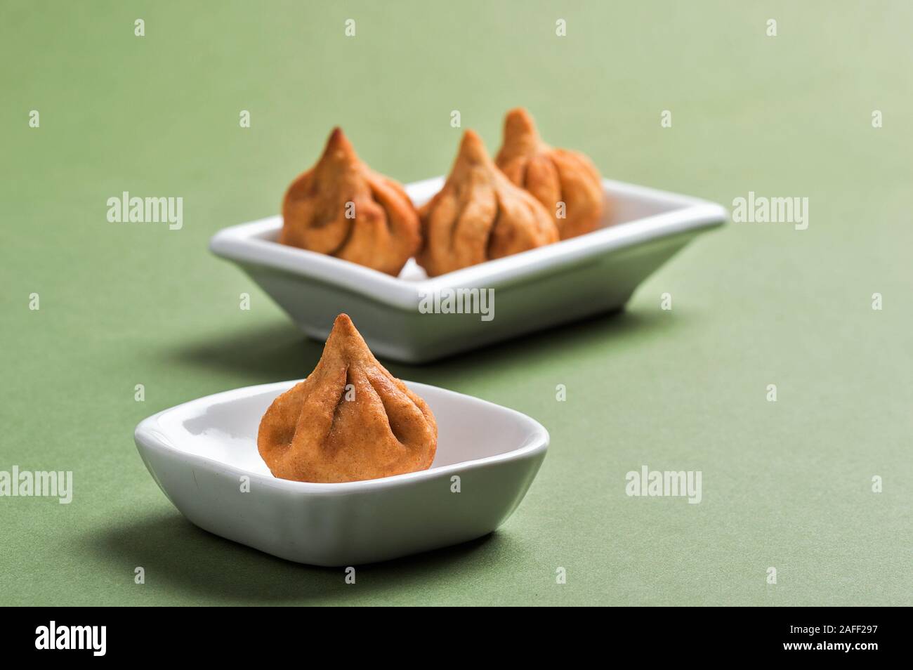 Indian Food: Modak on green background, Maharashtra Sweet Dish ...