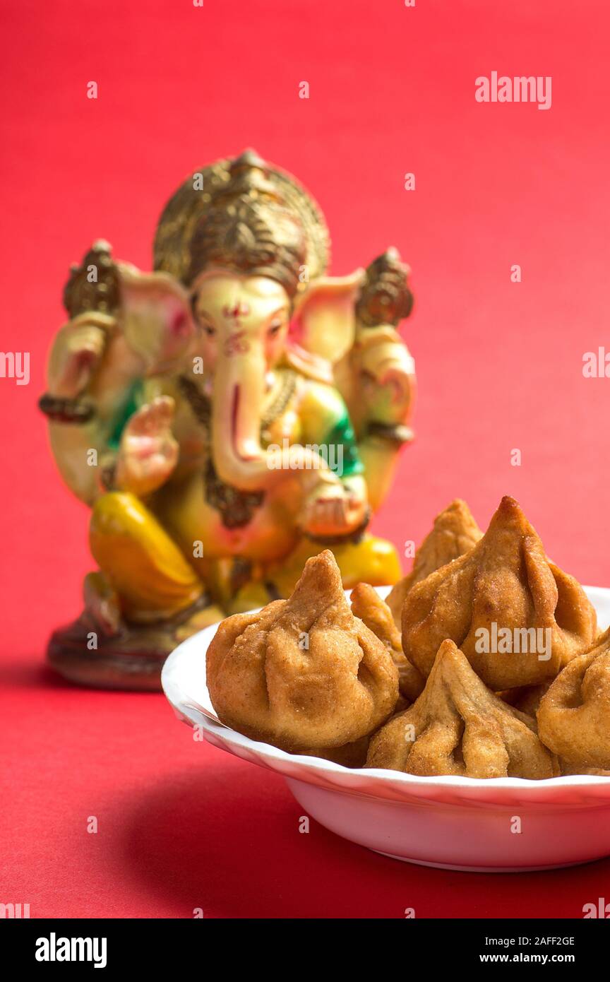 Indian Food: Modak with idol of lord Ganesha, Maharashtra Sweet Dish ...