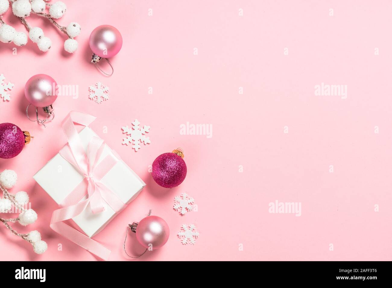 Christmas present box and decorations on pink background Stock Photo ...