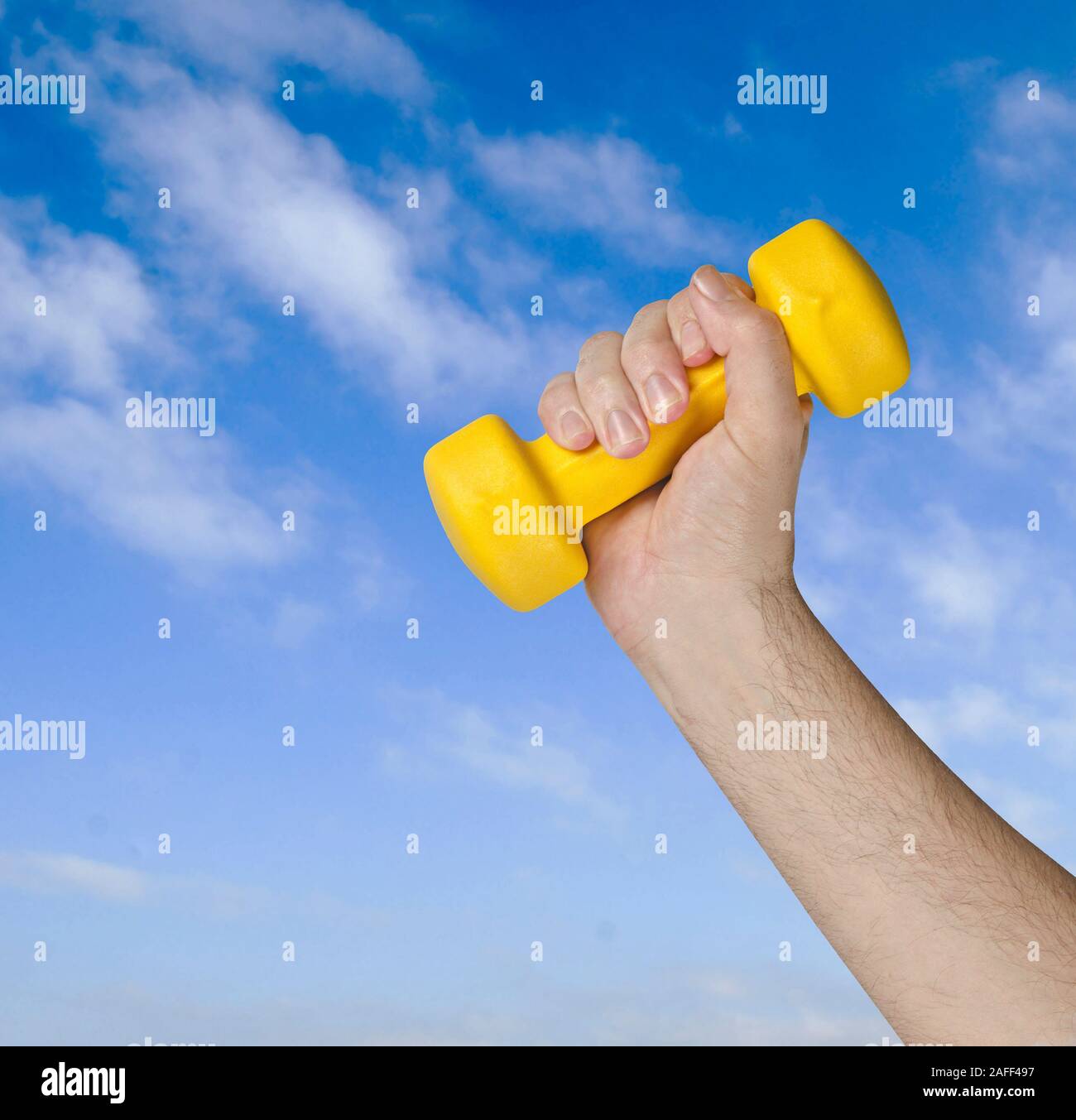 Dumbbell in hand Stock Photo - Alamy
