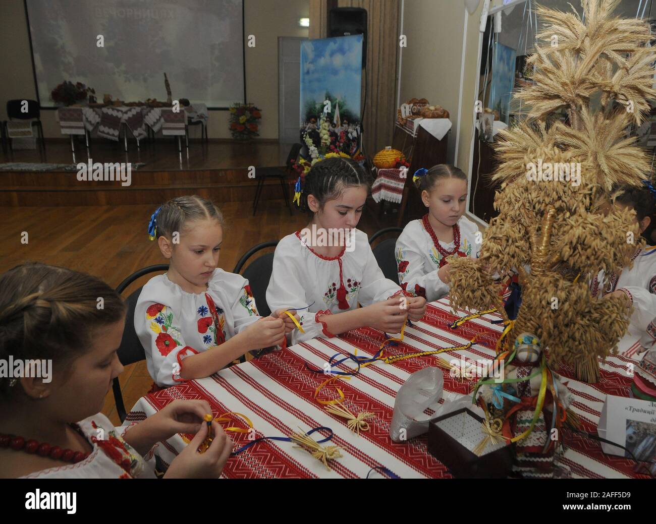 Kiev, Ukraine. 13th Dec, 2019. Pupils learning how to making didukhs ...