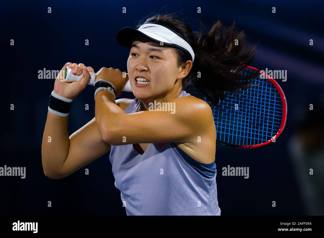 Lin Zhu of China in action during her first round match at the 2019 ...