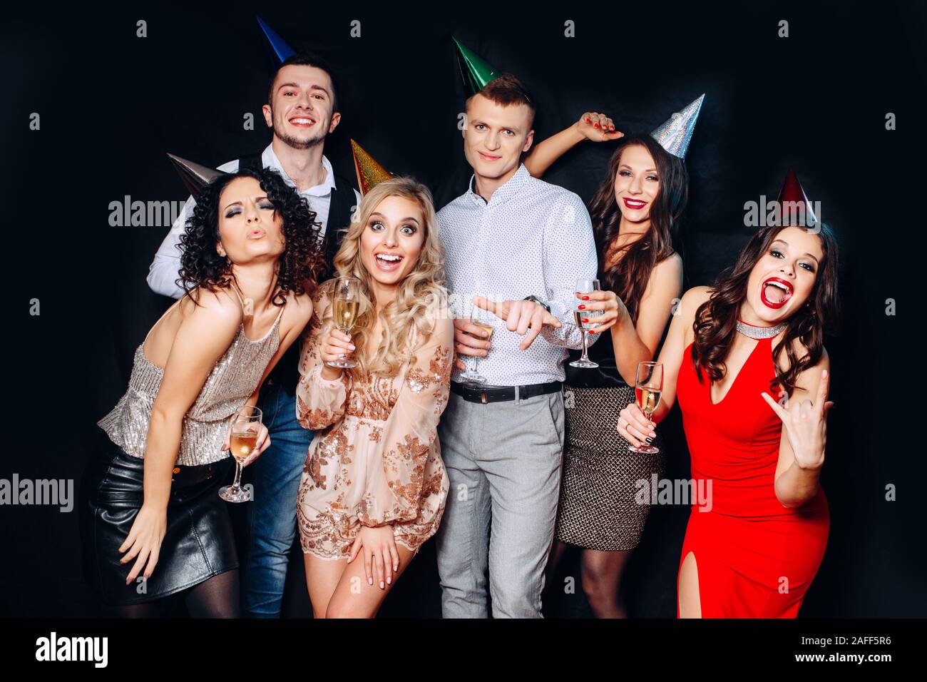 Friends birthday party. Six people having fun and drinking champagne on ...