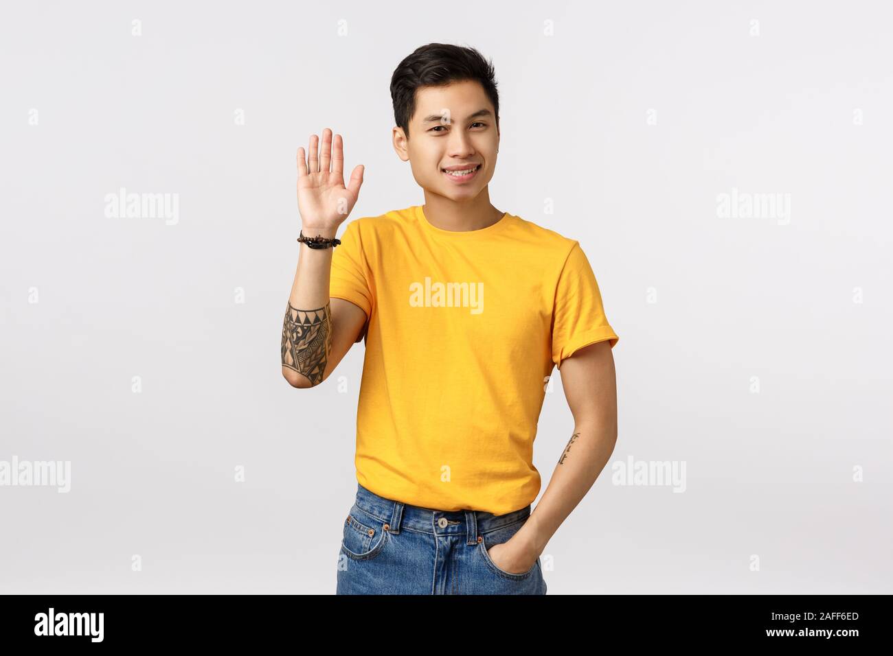 Friendly asian male student getting know new roommate in dorm, raising ...