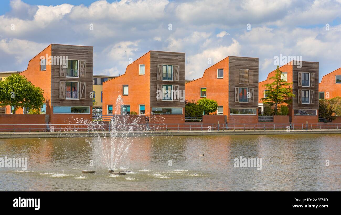 Modern detached family houses adjecent to water edge in suburb in ...