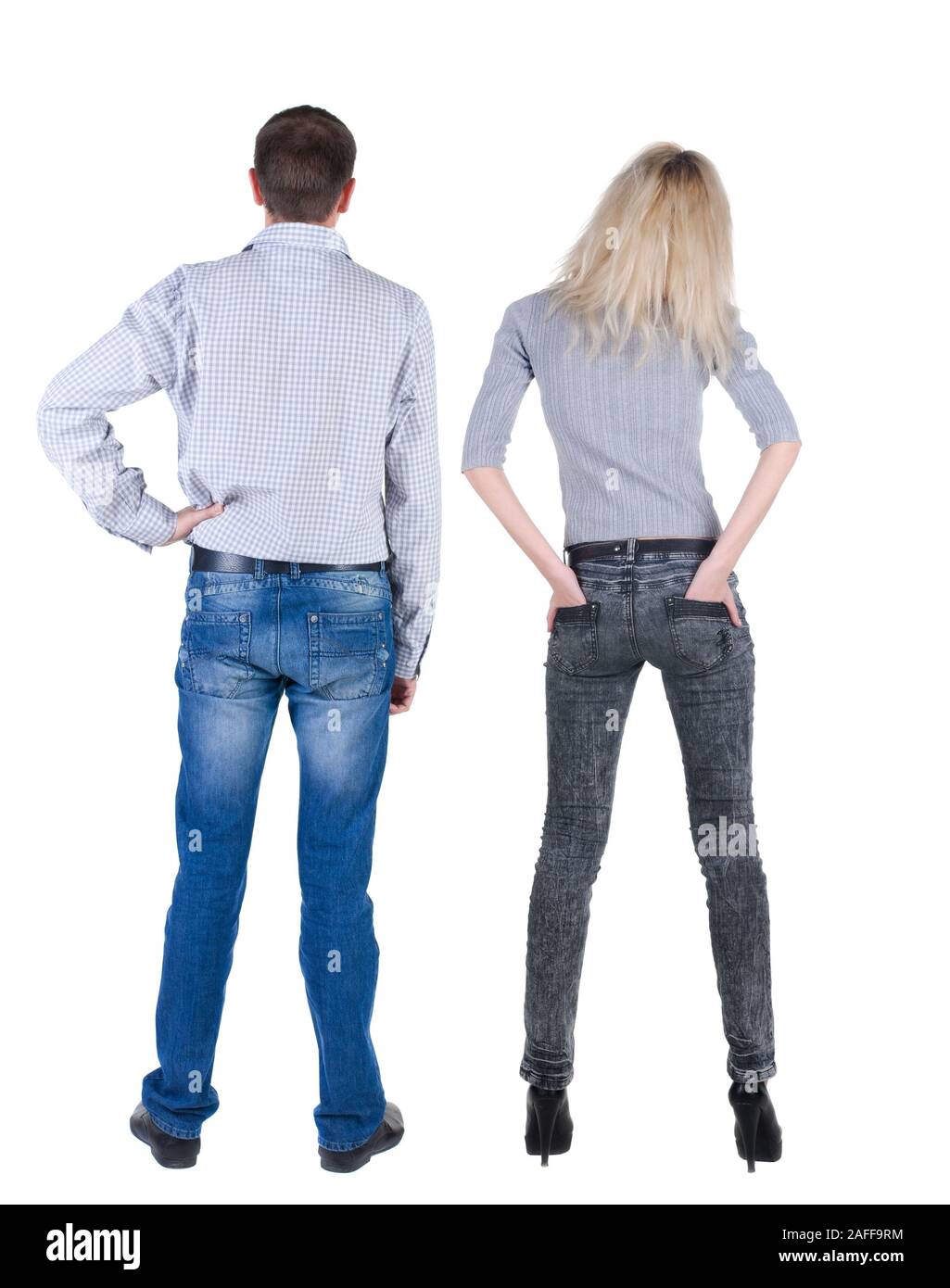 Back view of couple. beautiful friendly girl and guy together. Rear ...