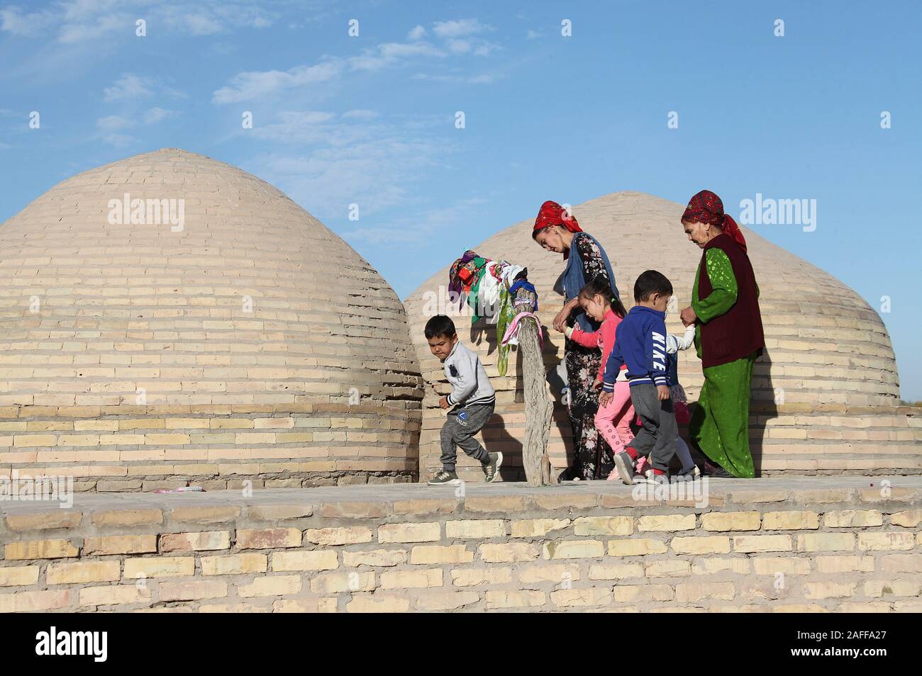 Pilgrim family at Kunya Urgench in Turkmenistan Stock Photo - Alamy