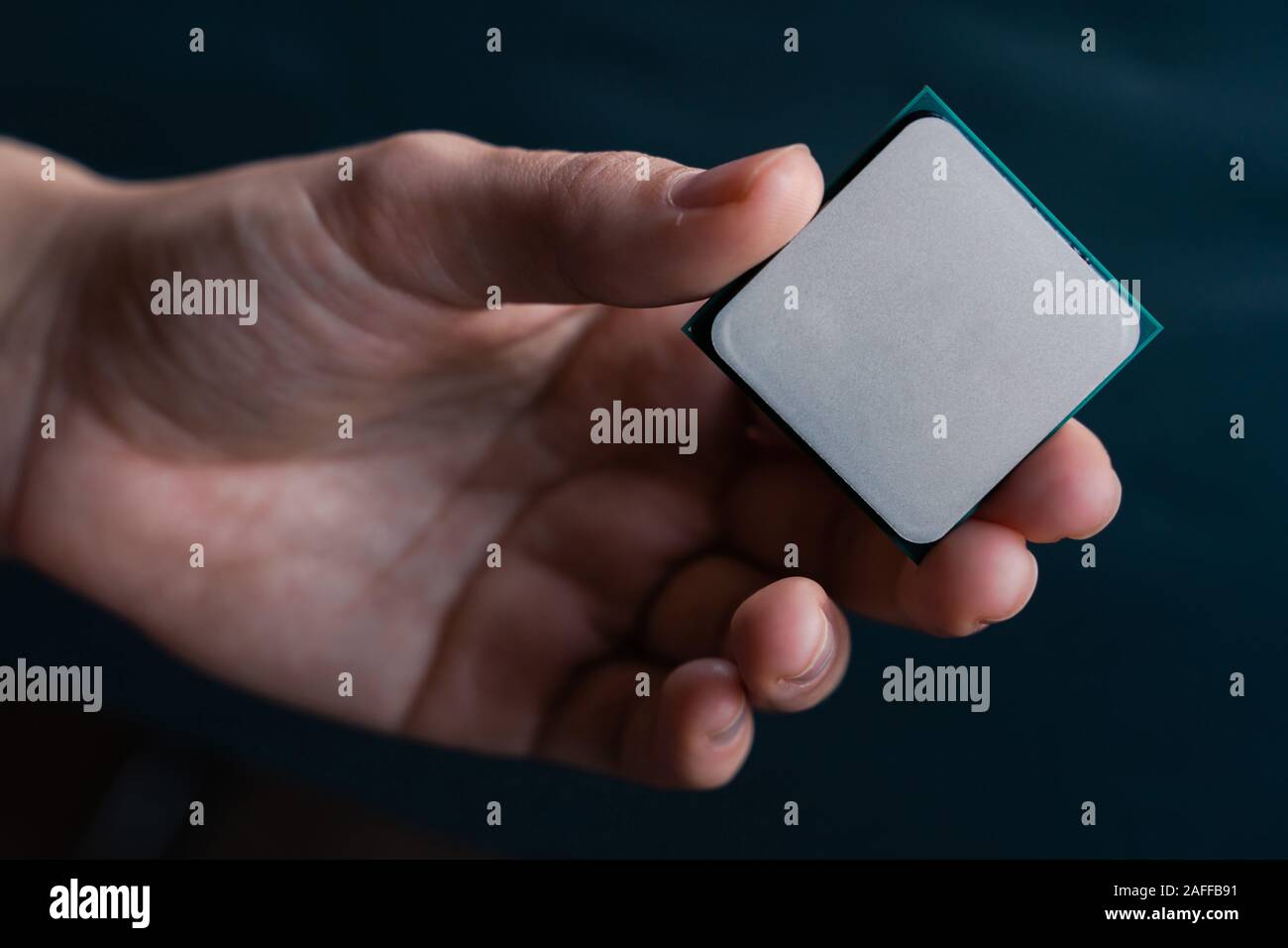 Hand holding CPU. Coonsumer 7 nanometer desktop CPU, processoor ...