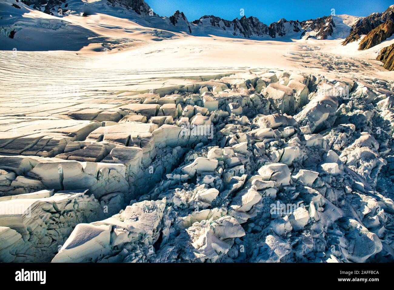 Huge slabs of frozen ice at the base of the magnificent mountain ...