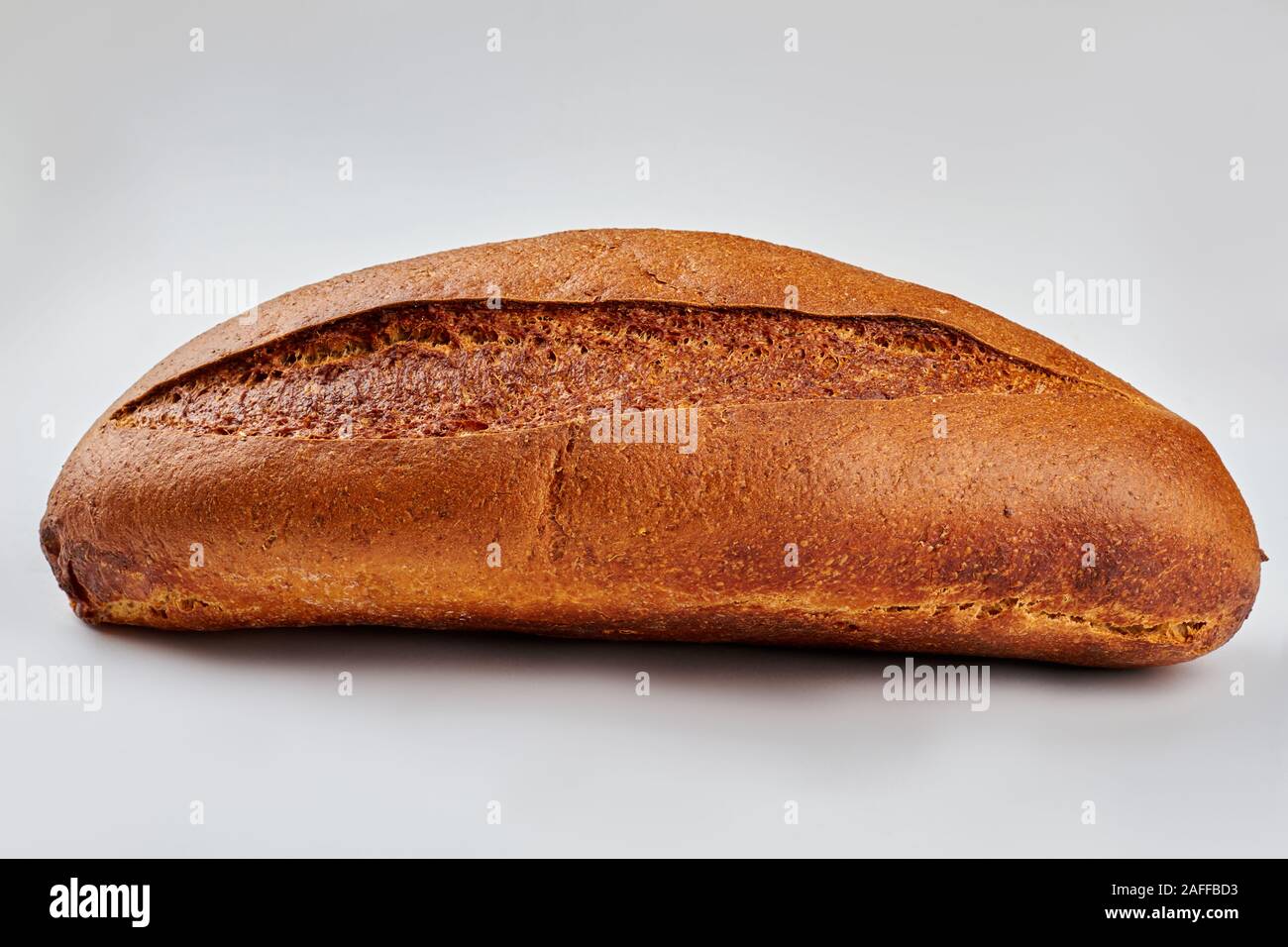 Crispy loaf of bread on white background Stock Photo - Alamy