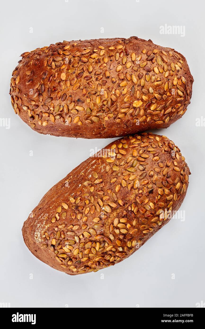 Natural whole grain bread on white background Stock Photo - Alamy