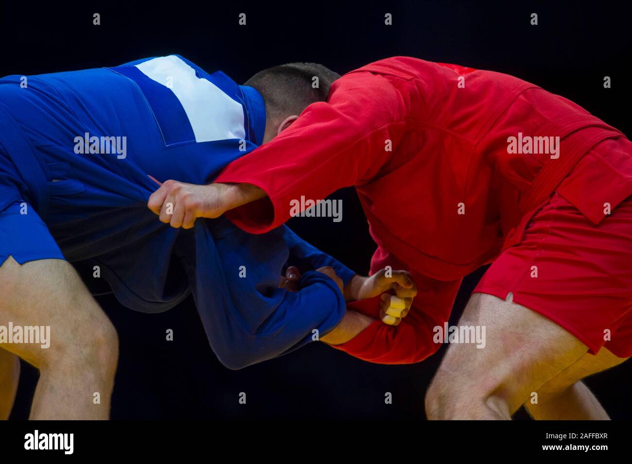 Sambo fighter attacking his opponent with leg technique Stock Photo - Alamy