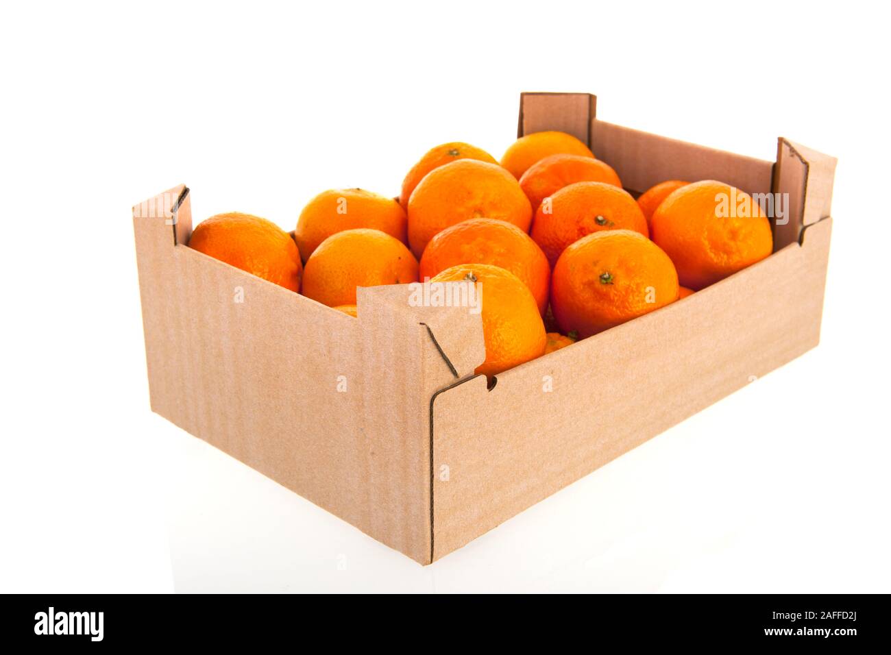 Carton crate tangerines isolated over white background Stock Photo - Alamy