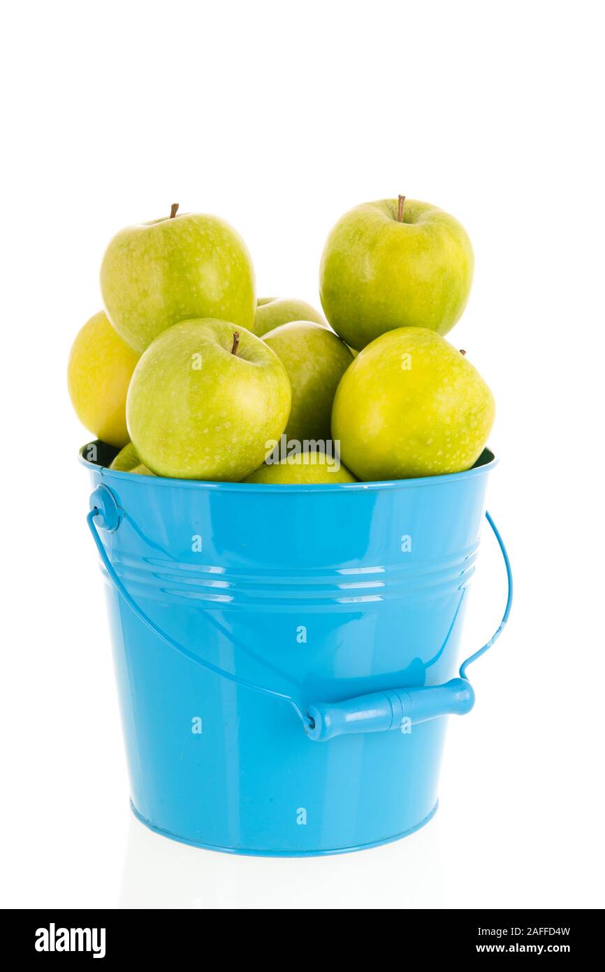 Bucket full green apples isolated over white background Stock Photo - Alamy