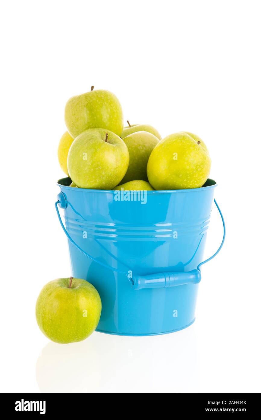 Bucket full green apples isolated over white background Stock Photo - Alamy