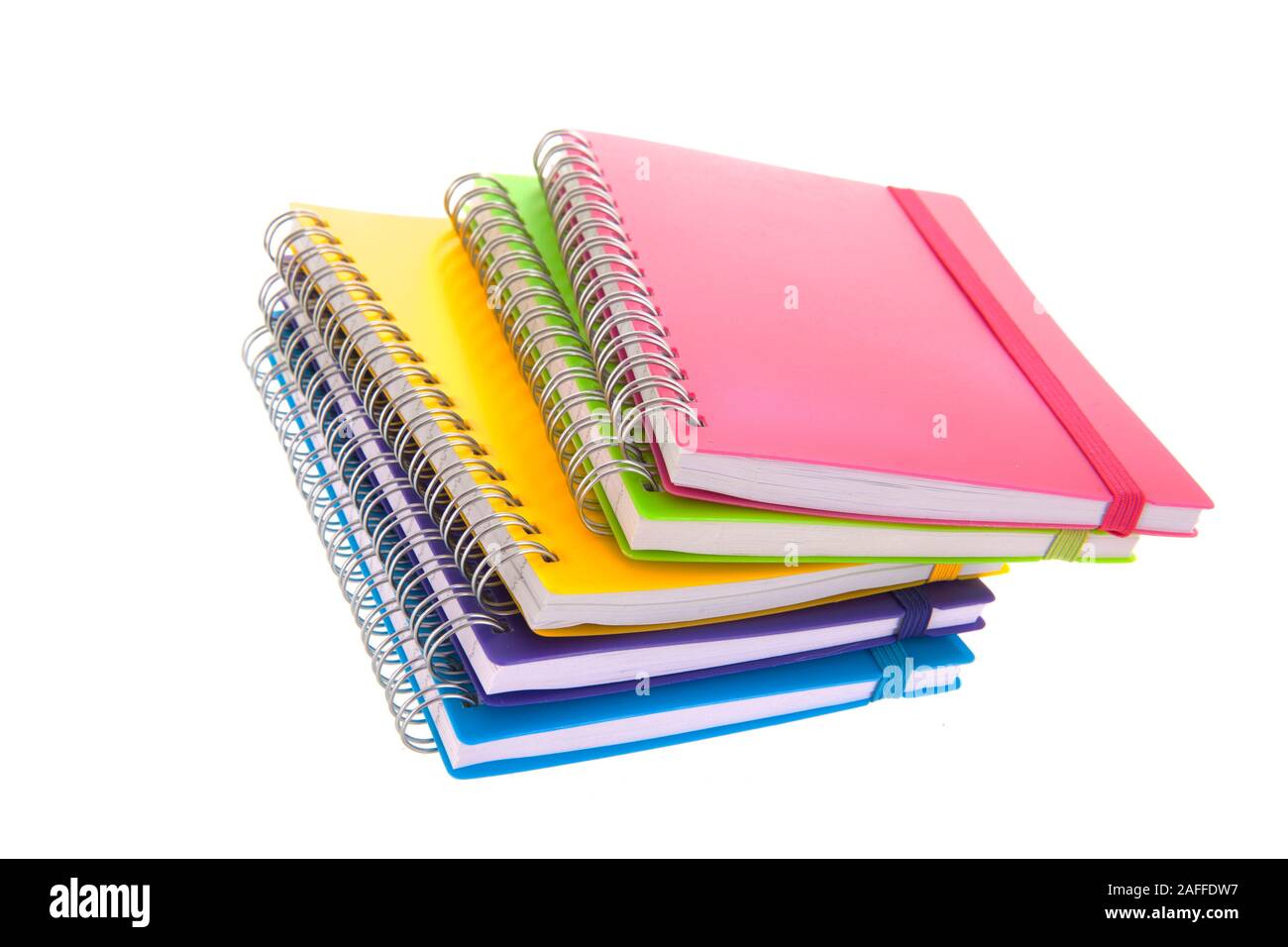 Stacked colorful notebooks isolated over white background Stock Photo ...