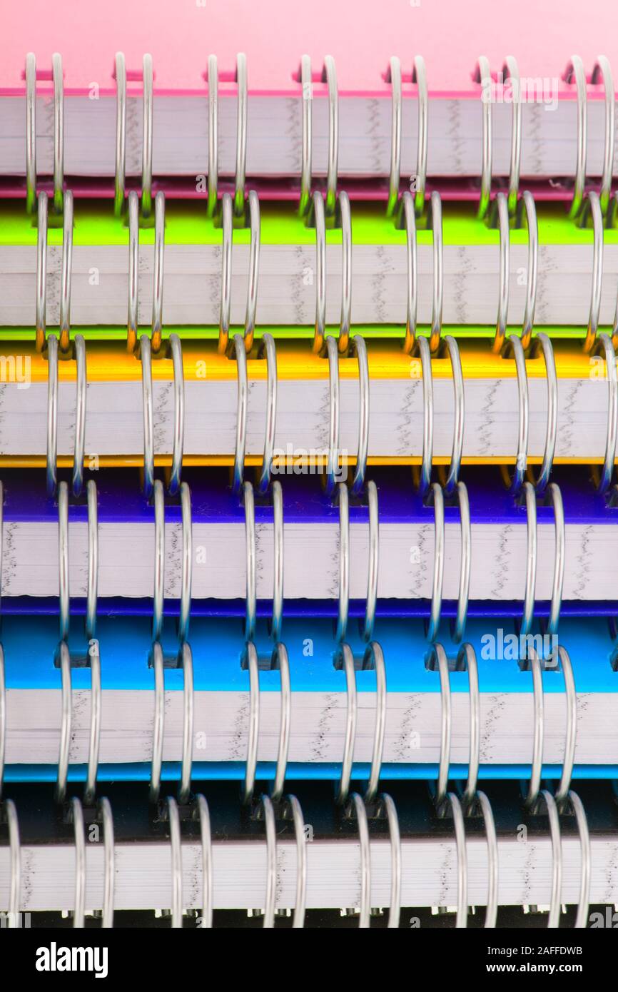Stacked colorful notebooks isolated over white background Stock Photo ...