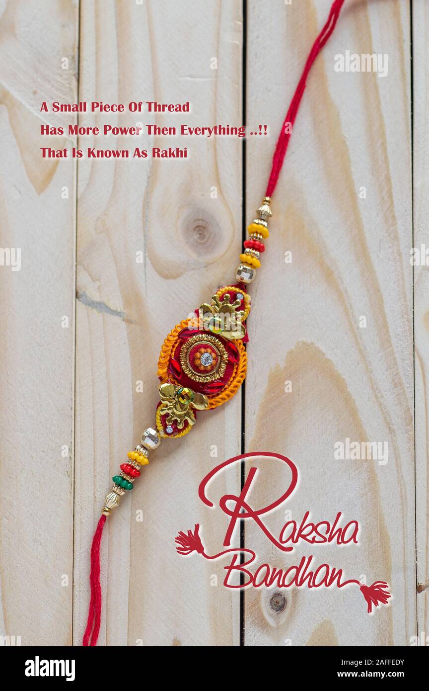 Raksha Bandhan background with an elegant Rakhi. A traditional Indian ...