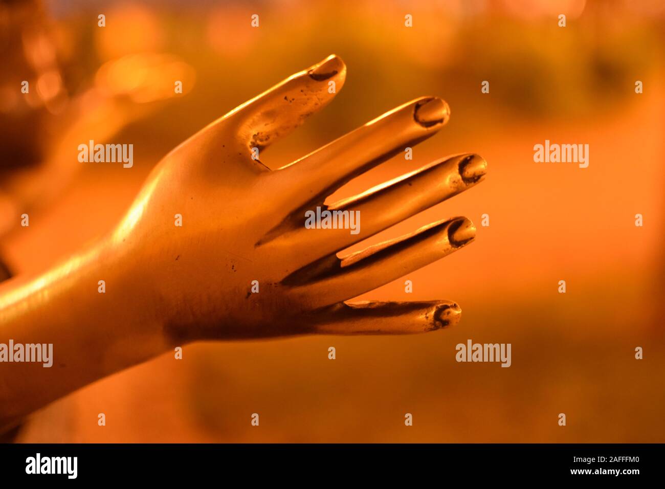 A fragment, the hand of a statue, a bronze hand reaching out to another ...