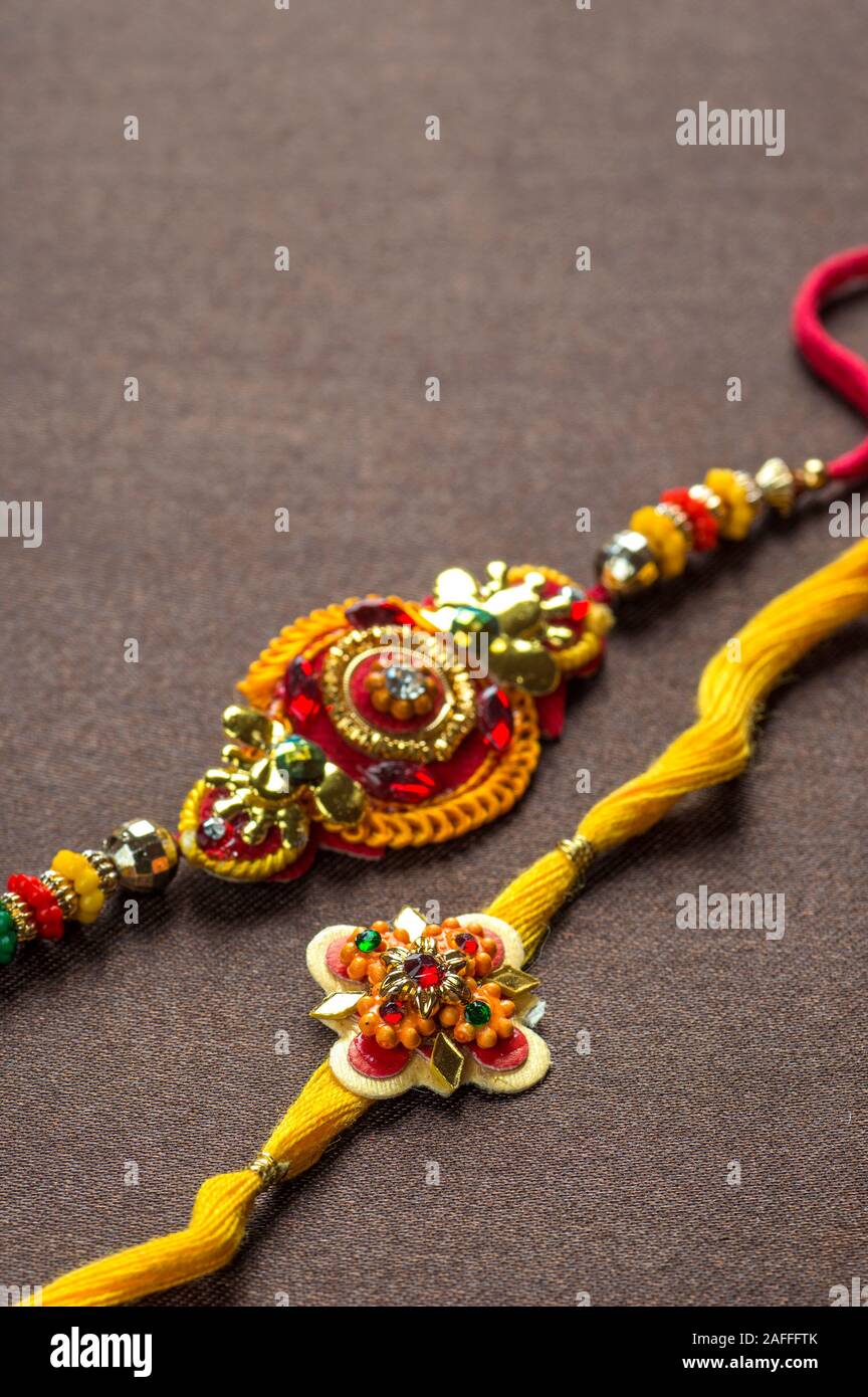 Raksha Bandhan background with an elegant Rakhi. A traditional Indian ...