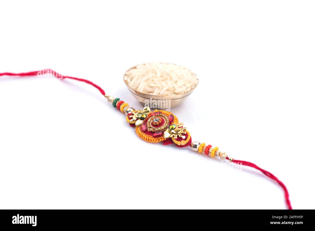 Indian festival: Raksha Bandhan background with an elegant Rakhi on a ...