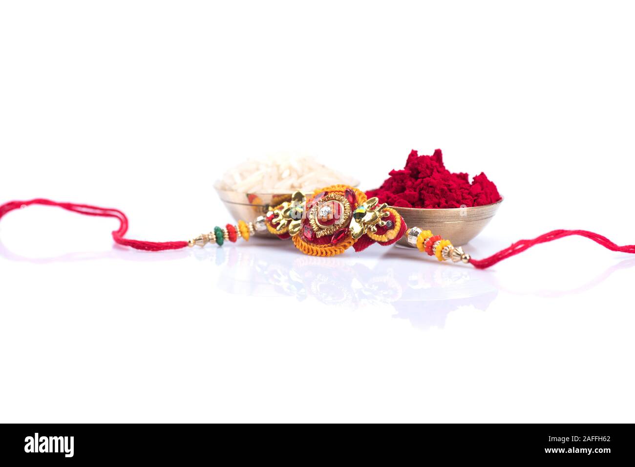 Indian festival: Raksha Bandhan background with an elegant Rakhi on a ...