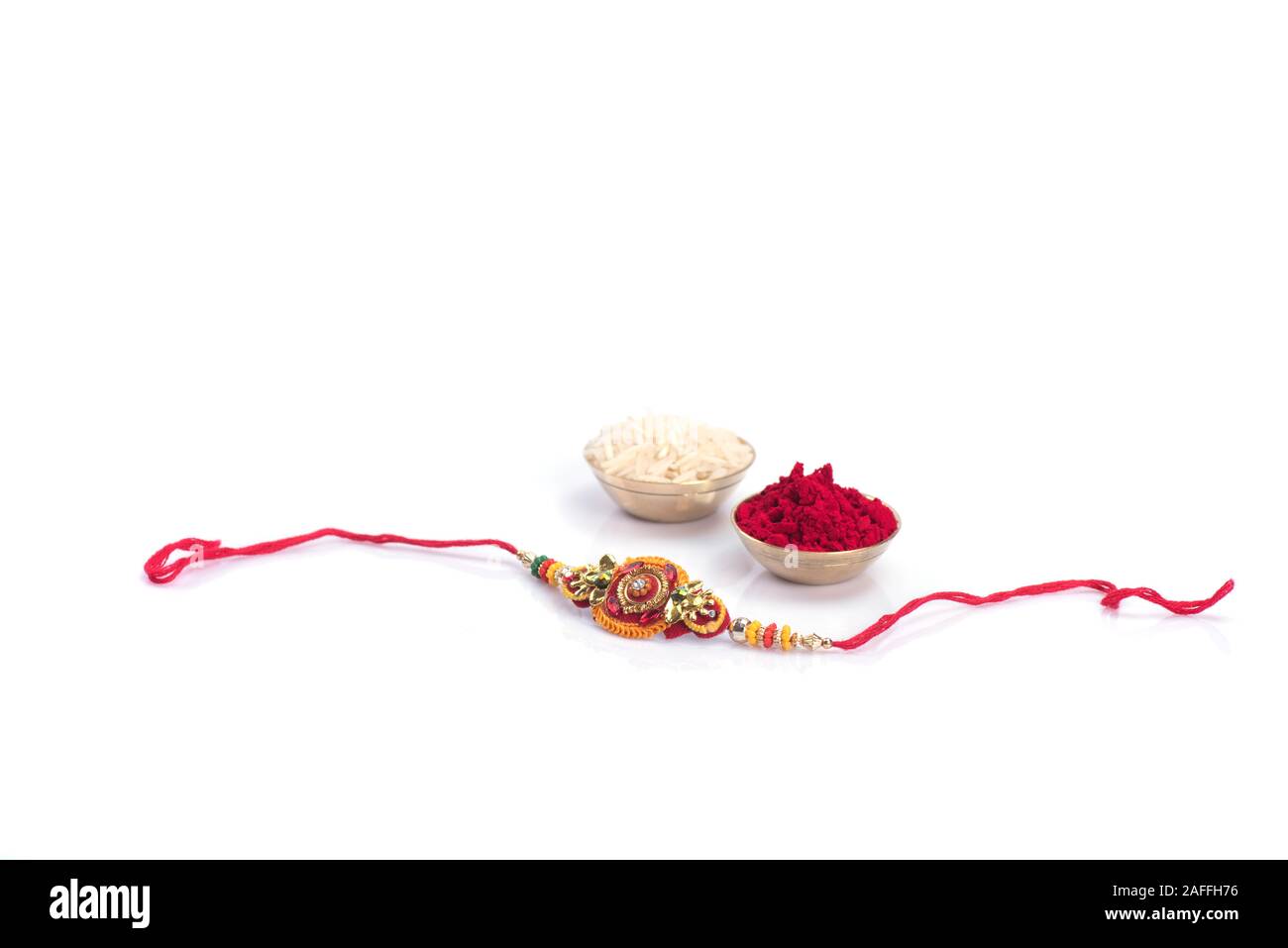 Indian festival: Raksha Bandhan background with an elegant Rakhi on a ...