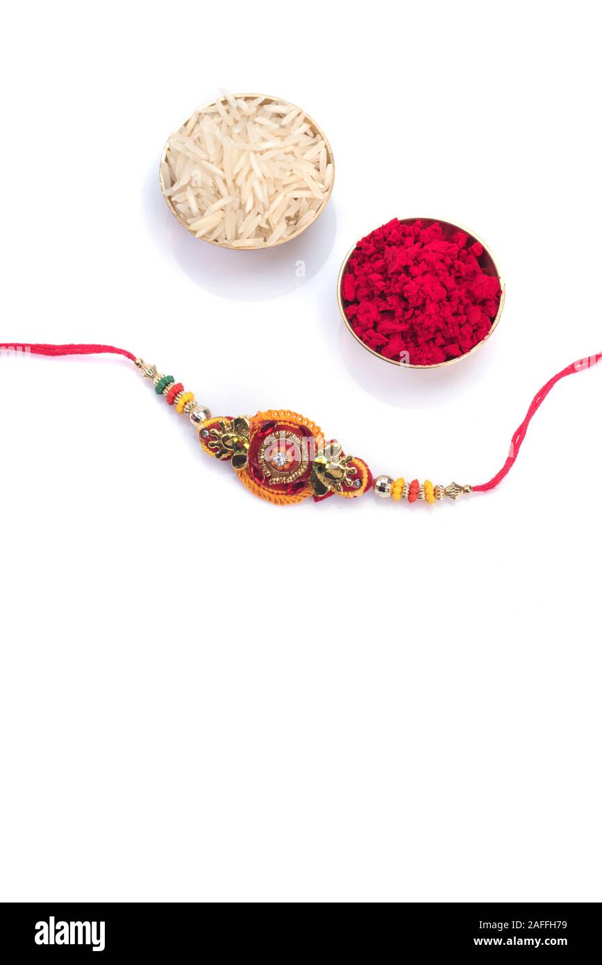 Indian festival: Raksha Bandhan background with an elegant Rakhi on a ...