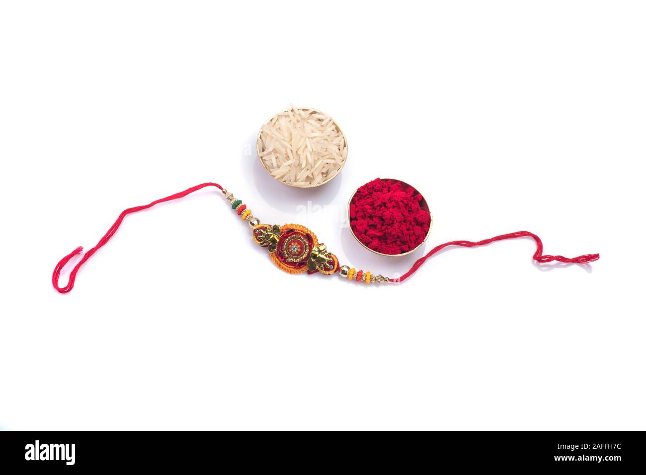 Indian festival: Raksha Bandhan background with an elegant Rakhi on a ...