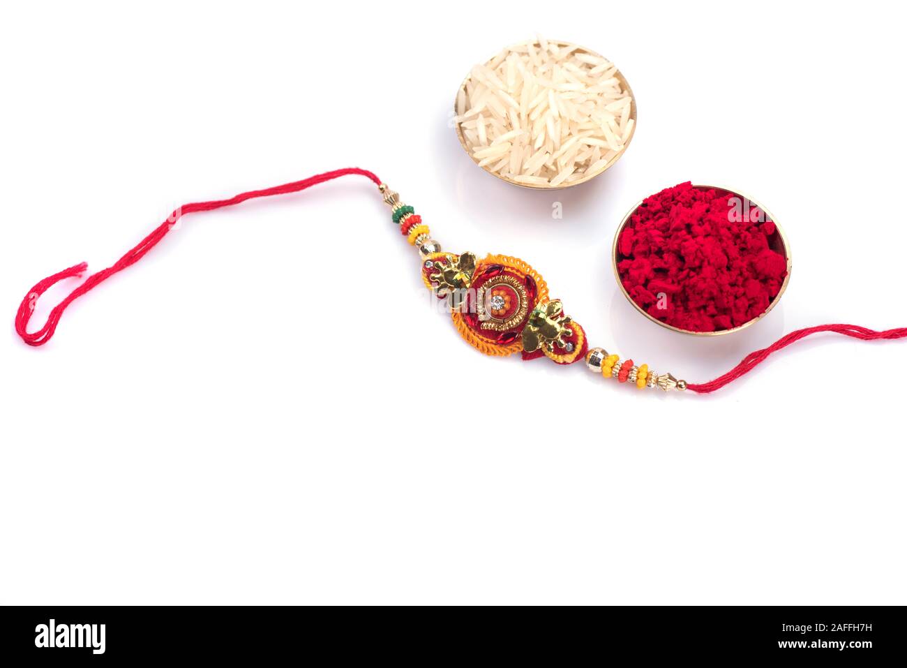Indian festival: Raksha Bandhan background with an elegant Rakhi on a ...