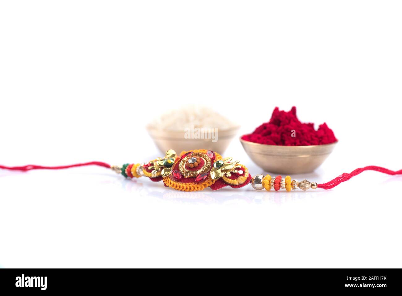 Indian festival: Raksha Bandhan background with an elegant Rakhi on a ...