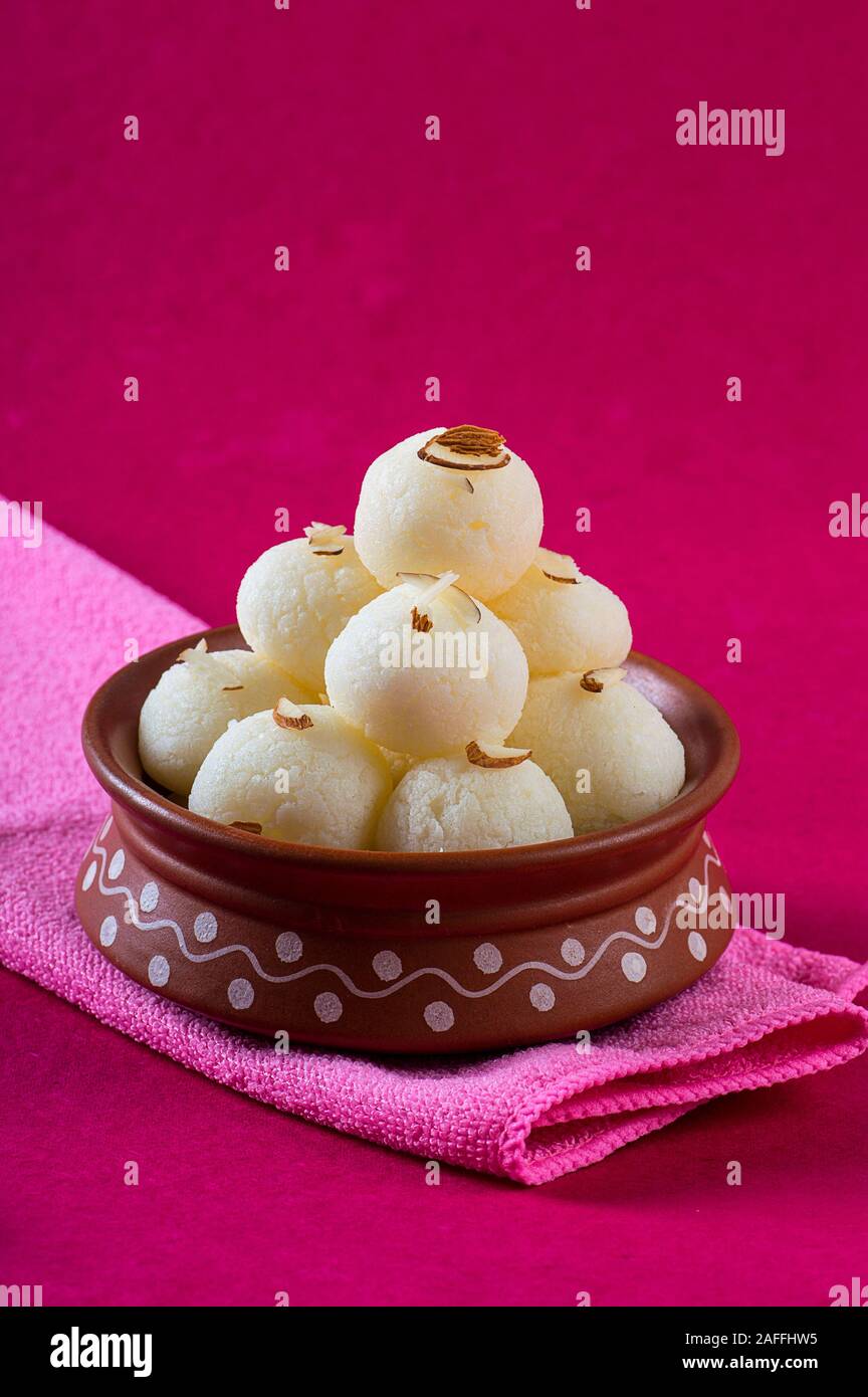 Indian Sweet - Rasgulla, Famous Bengali sweet in clay bowl with napkin ...