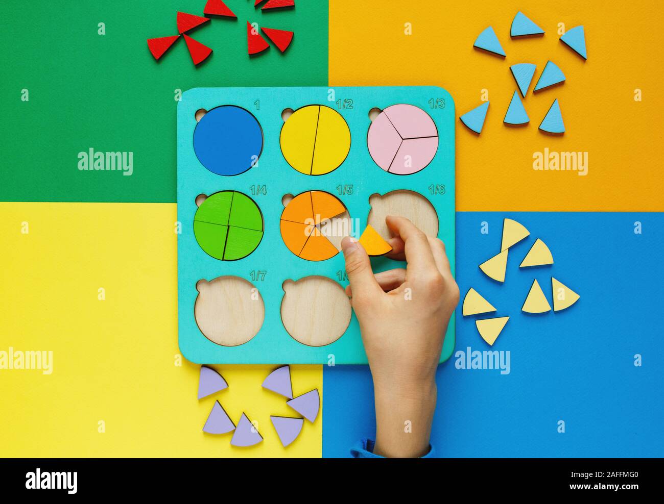 Wooden kids toys on colourful paper. Educational fractions. Toys for ...