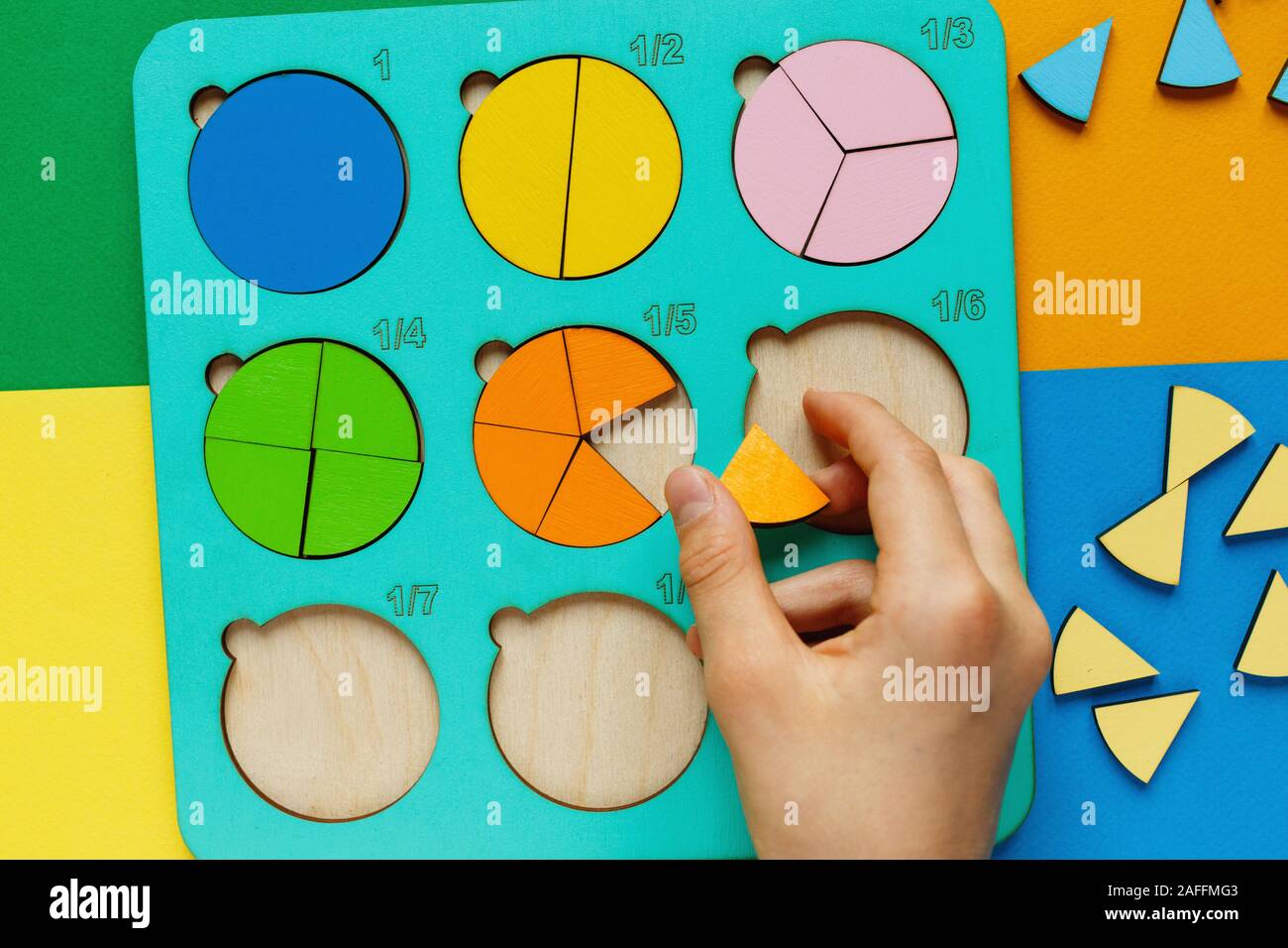 Wooden kids toys on colourful paper. Educational fractions. Toys for ...