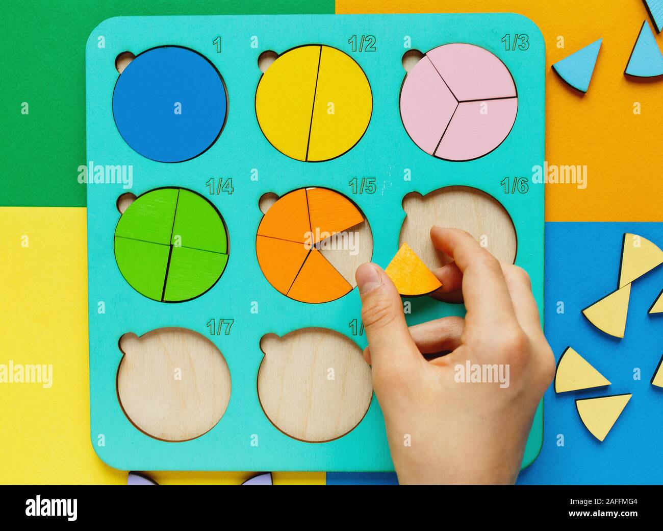 Wooden kids toys on colourful paper. Educational fractions. Toys for ...
