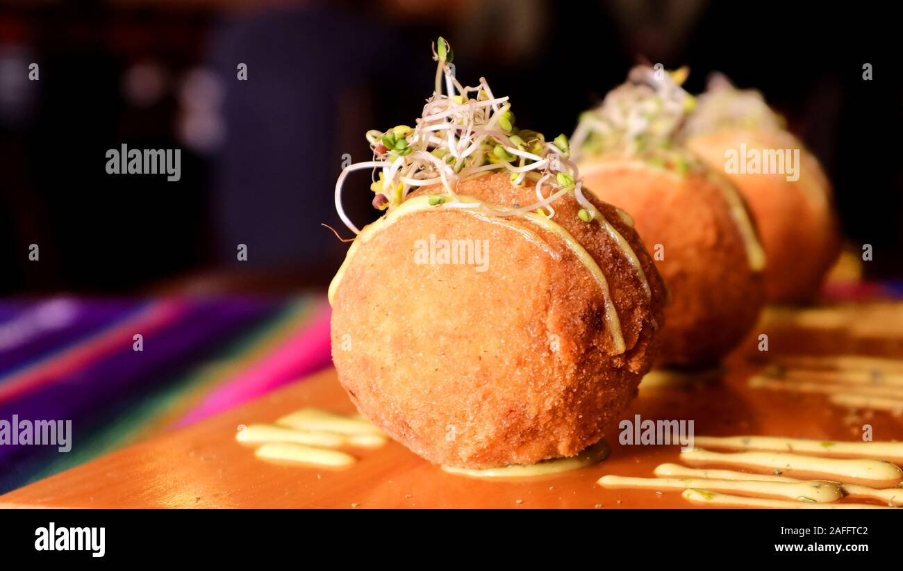 Ecuadorian bolon de verde or green plantain dumplings stuffed with ...
