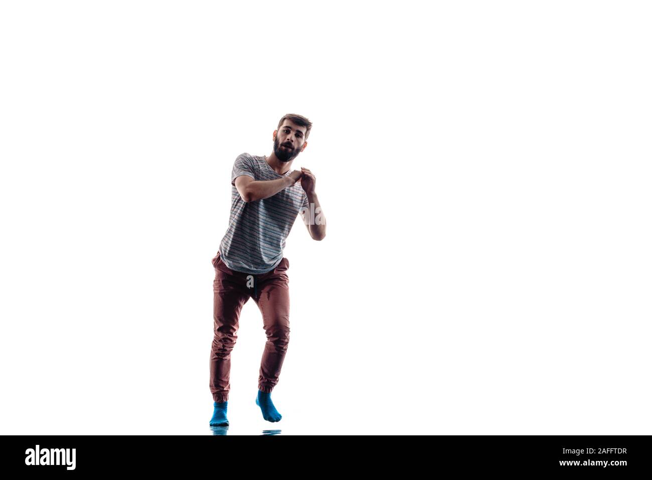 Muscular dance performer practicing dance moves at the studio Stock ...