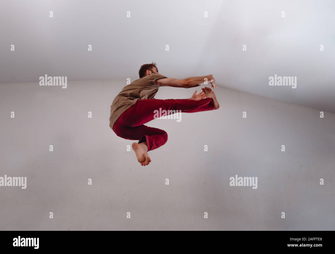 Dance moves performed by an acrobatic flexible male dancer Stock Photo ...