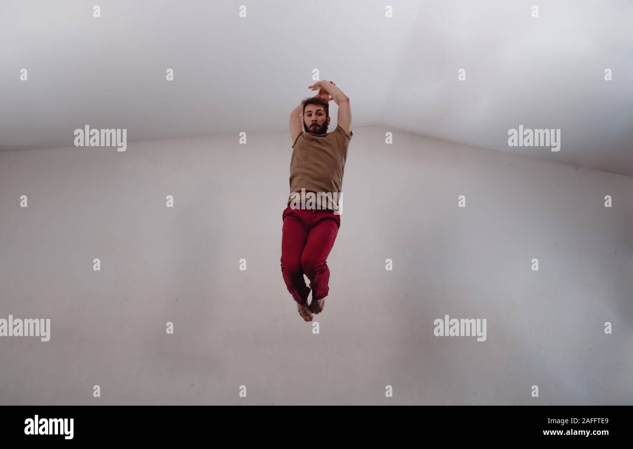 Handsome young man performing a contemporary dance routine Stock Photo ...