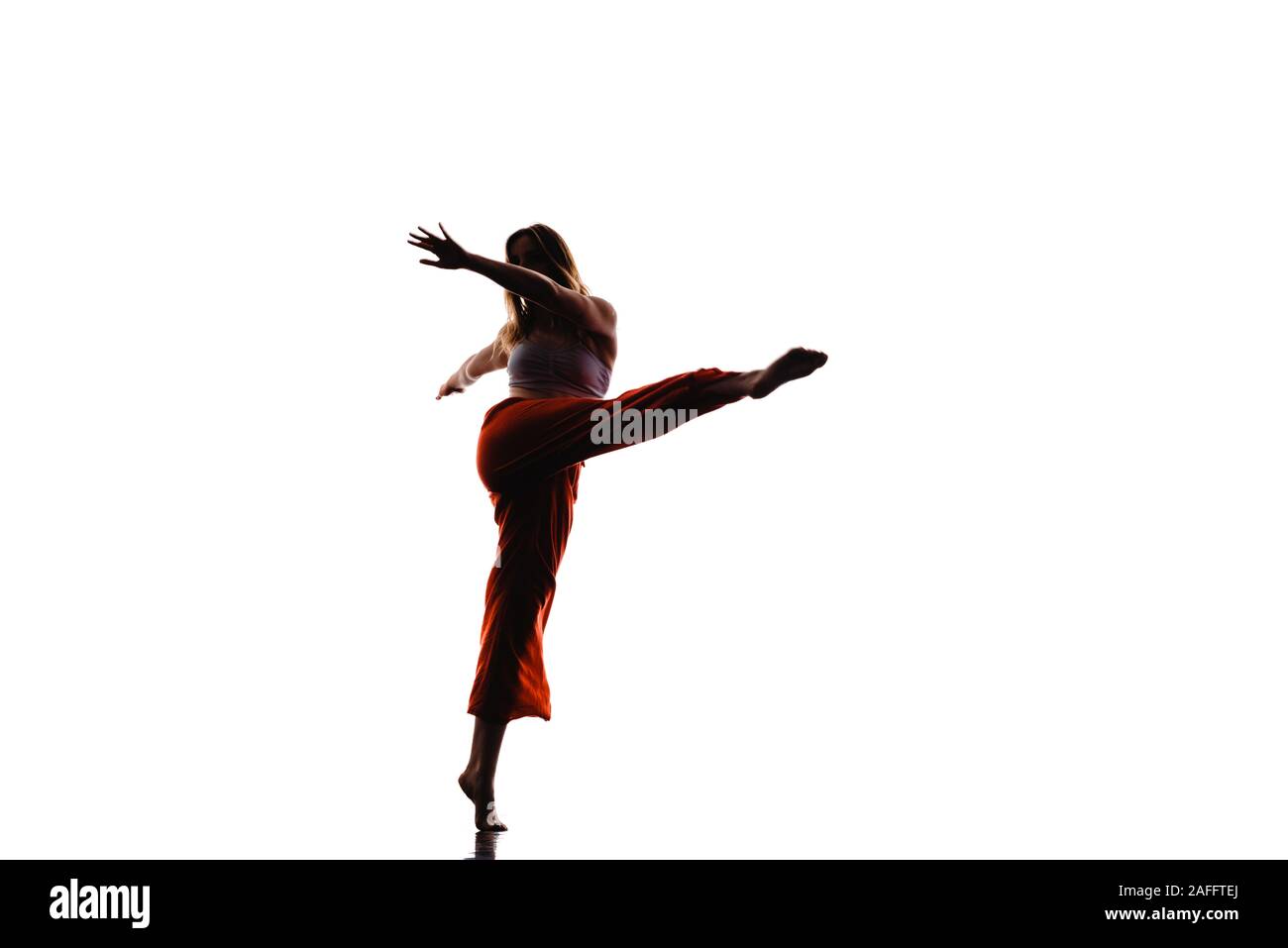 Stylish young woman performing an elegant dance choreography Stock ...